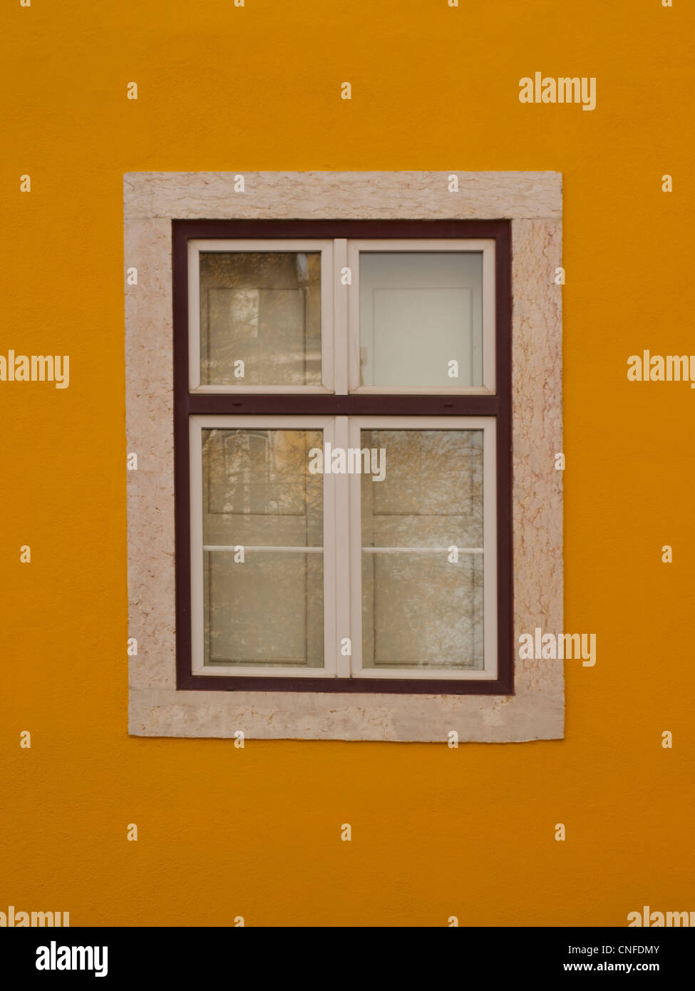 Yellow building window Stock Photo - Alamy
