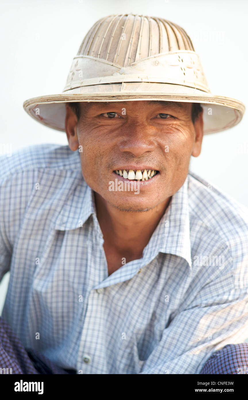 Friendly Burmese man in distinctive Burmese style hat. Pyin Oo Lwin ...