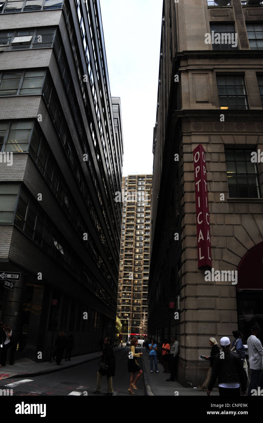 White sky dark shade 'urban alley' portrait buildings, people walking ...