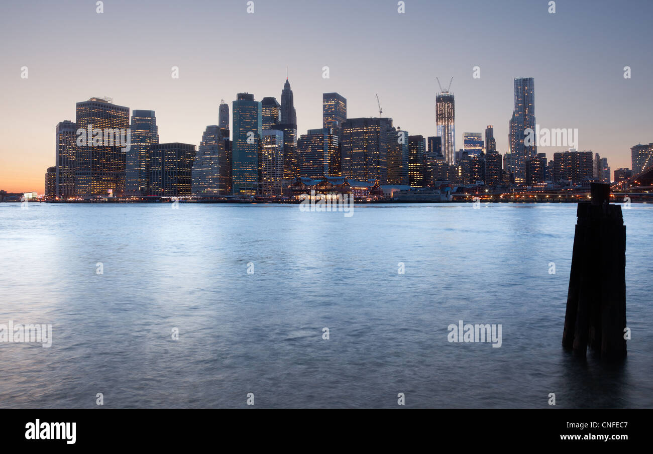 Lower Manhattan at sunset by Brooklyn Bridge Stock Photo - Alamy