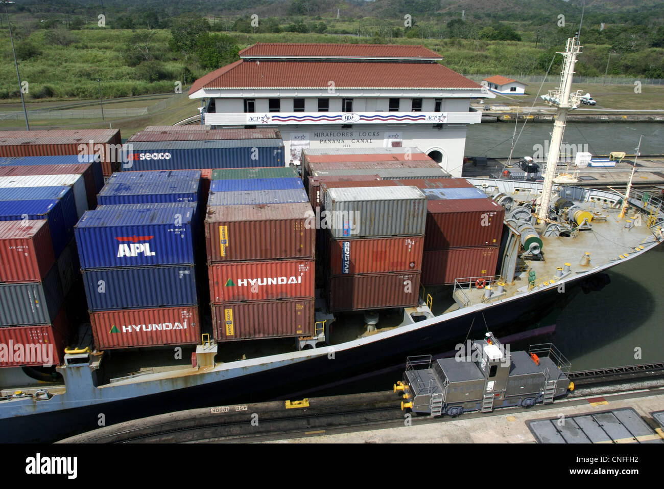 Container ship passing through the Miraflores Locks in the Panama Canal ...