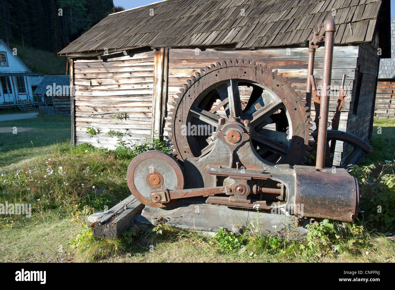 Village scenery with log-cabin and historic steam-engine Stock Photo ...