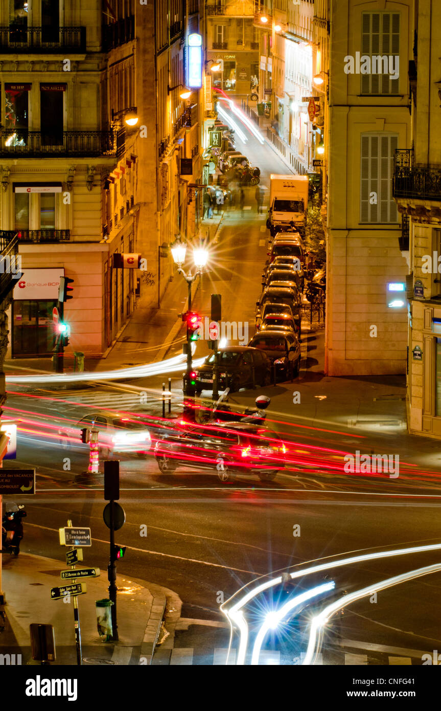 Time-lapse of car lights at night at the intersection of Rue Saint-Roch ...