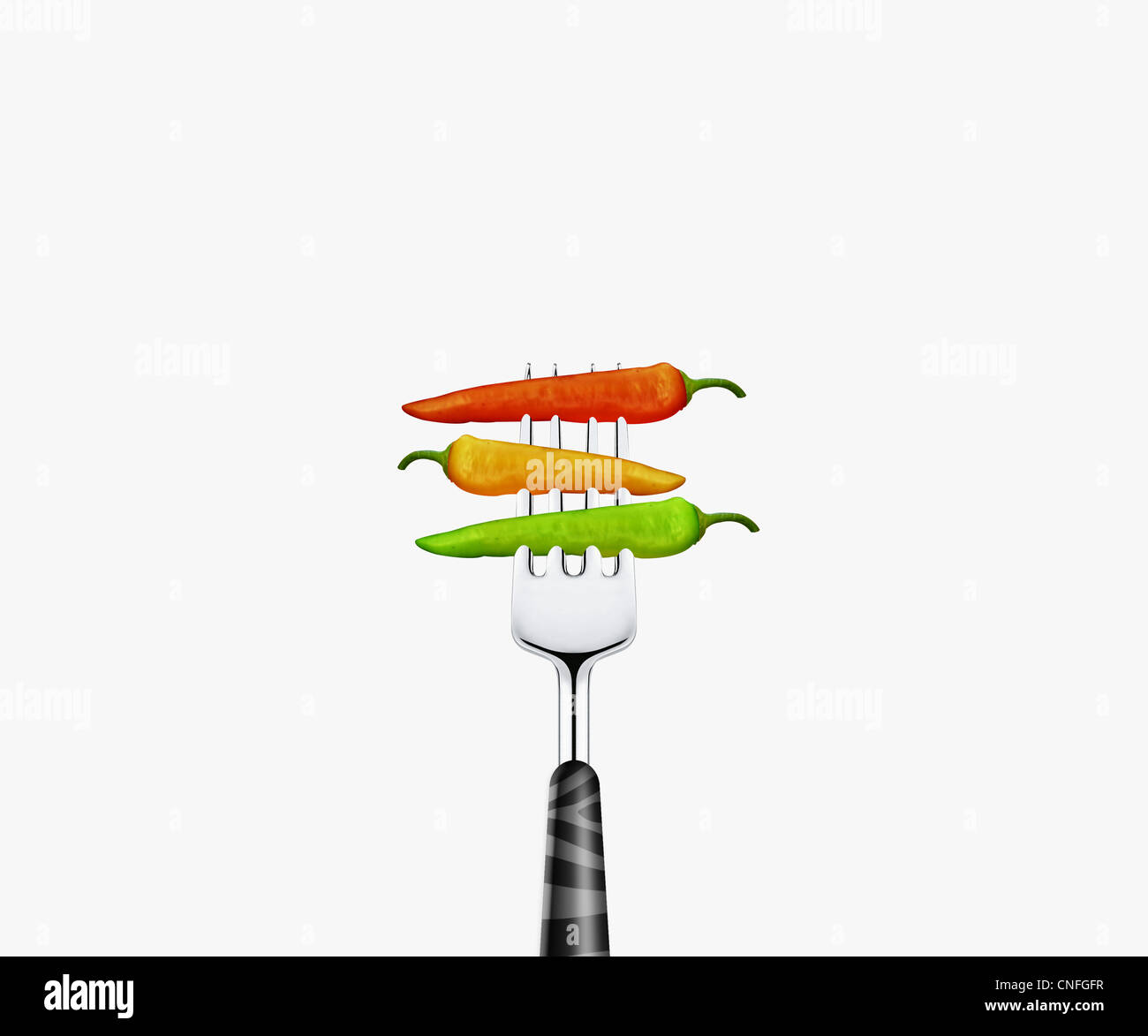 close up of Three chilies pierced by fork, isolated on white background ...