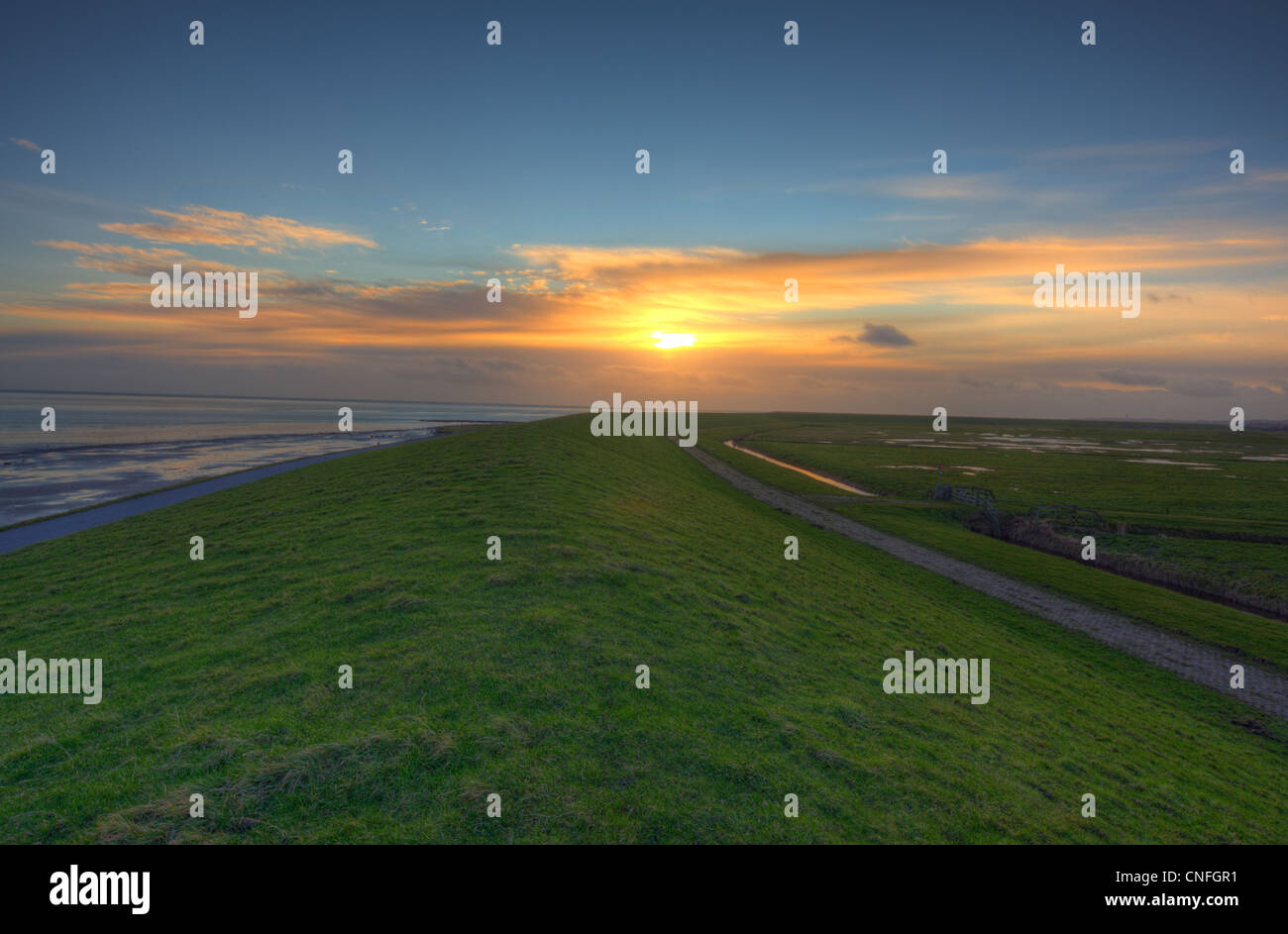 A dike in the Netherlands at sunrise Stock Photo - Alamy