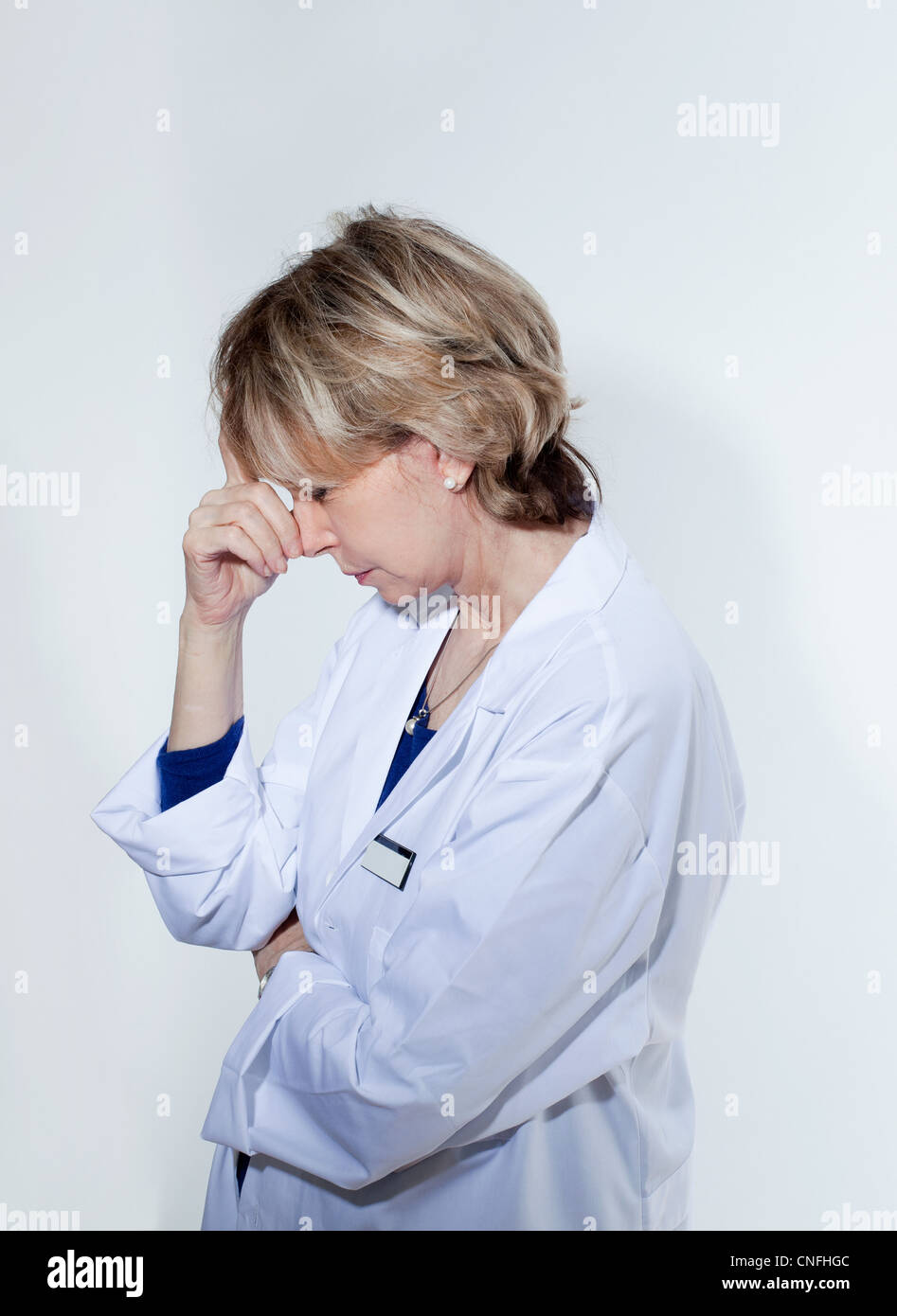 Doctor looking concerned Stock Photo - Alamy