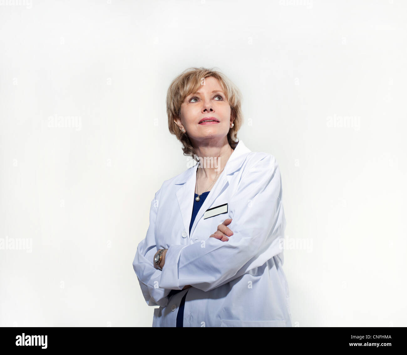 Doctor looking up Stock Photo - Alamy