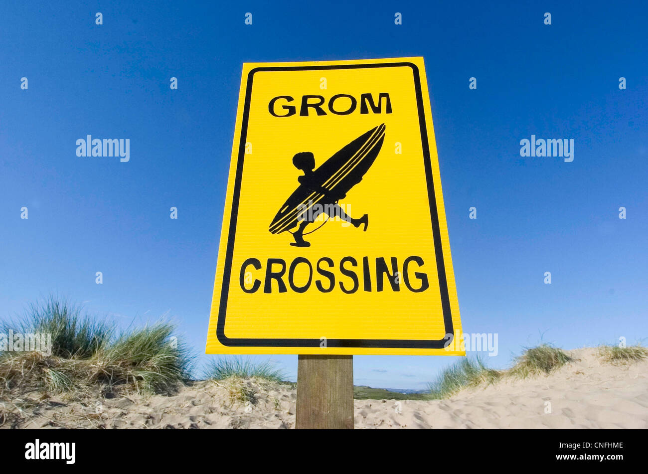 Groms crossing sign on beach at Llangennith on the Gower Peninsula near ...