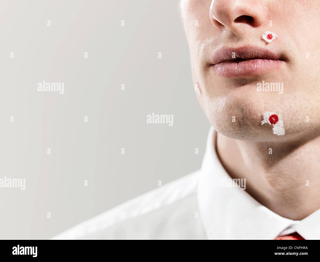 Young man with shaving marks, studio shot Stock Photo - Alamy