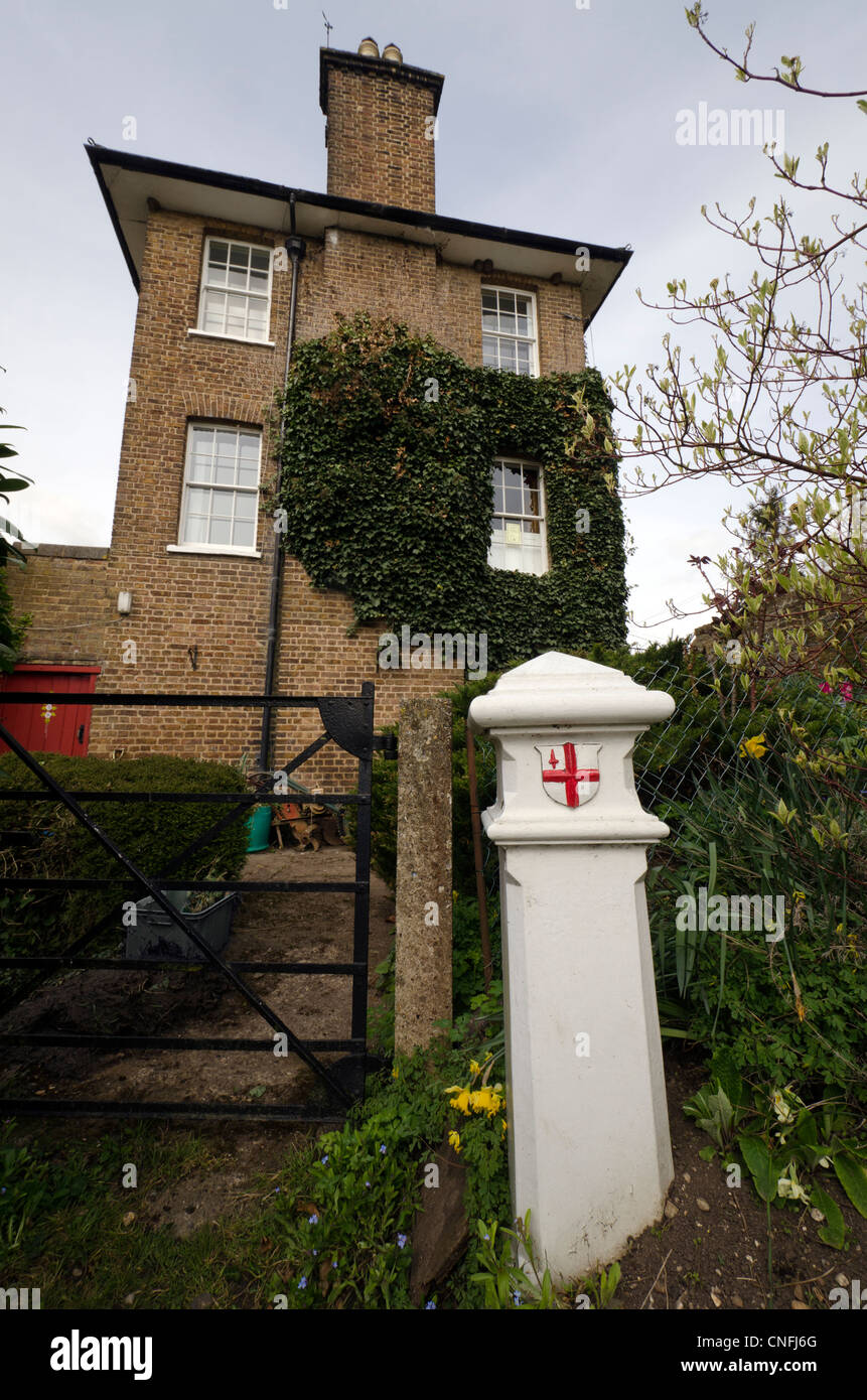 A cast iron coal tax post outside a permanent house for the tax ...
