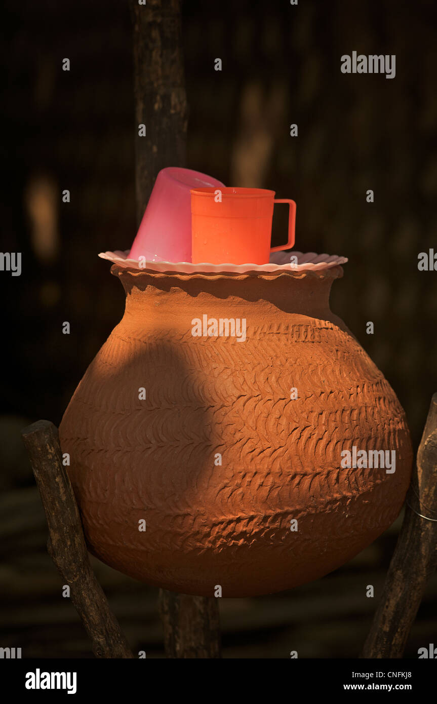 Terracotta water jug and two plastic cups. Burma. Myanmar Stock Photo ...