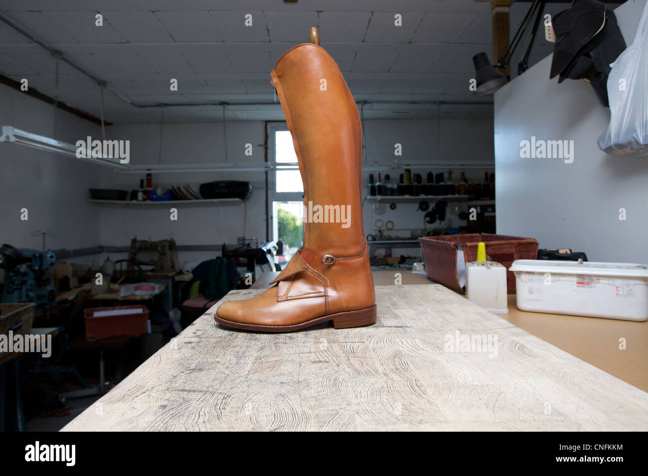 A leather riding boot in a shoe makers workshop Stock Photo - Alamy