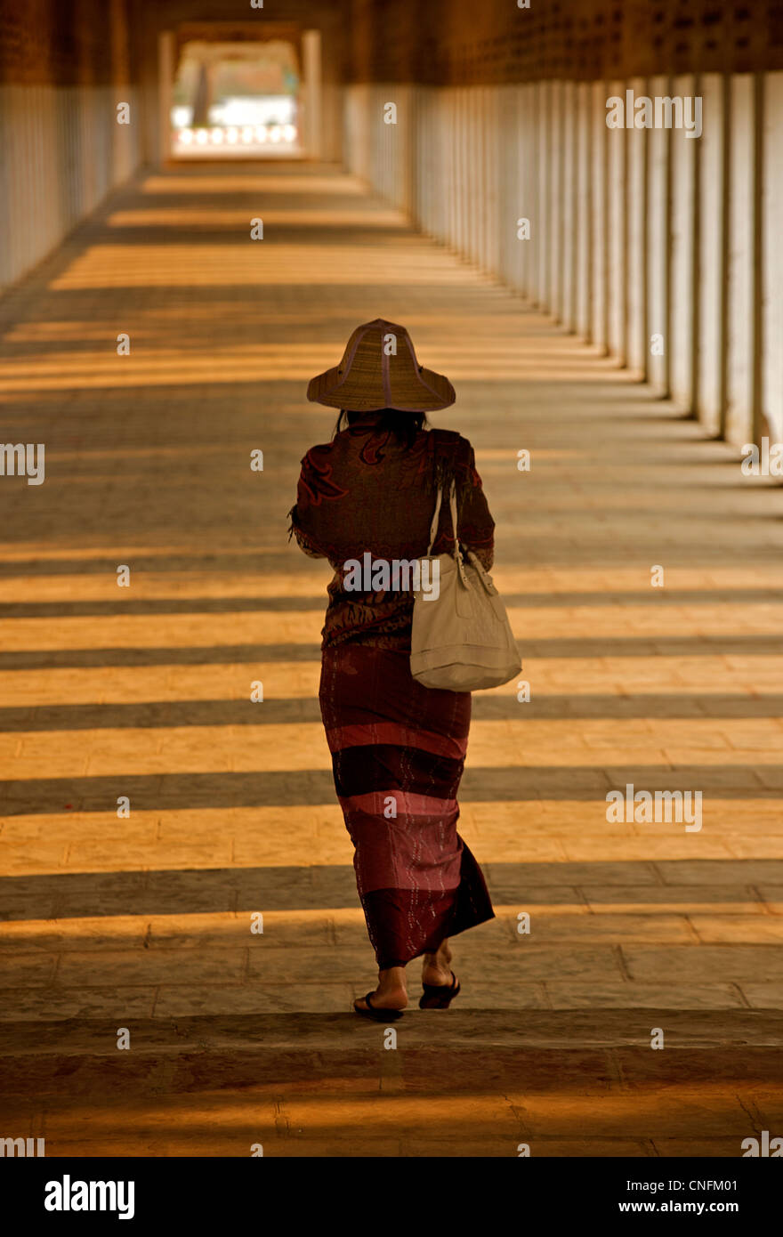 Burmese woman walking down the corridor at Shwezigon Pagoda, Bagan ...