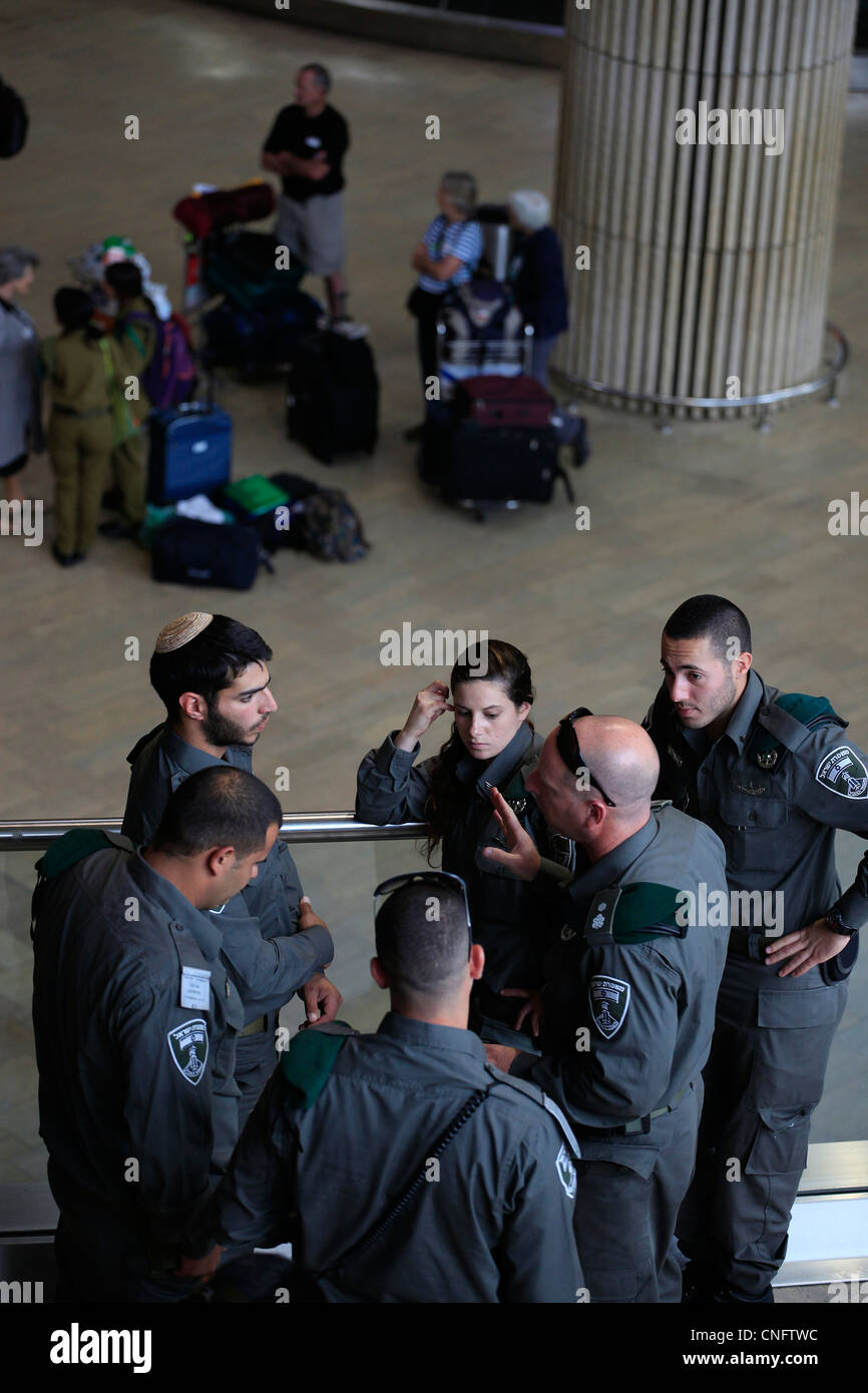 Israeli border police officers having a brief in the terminal of Ben ...