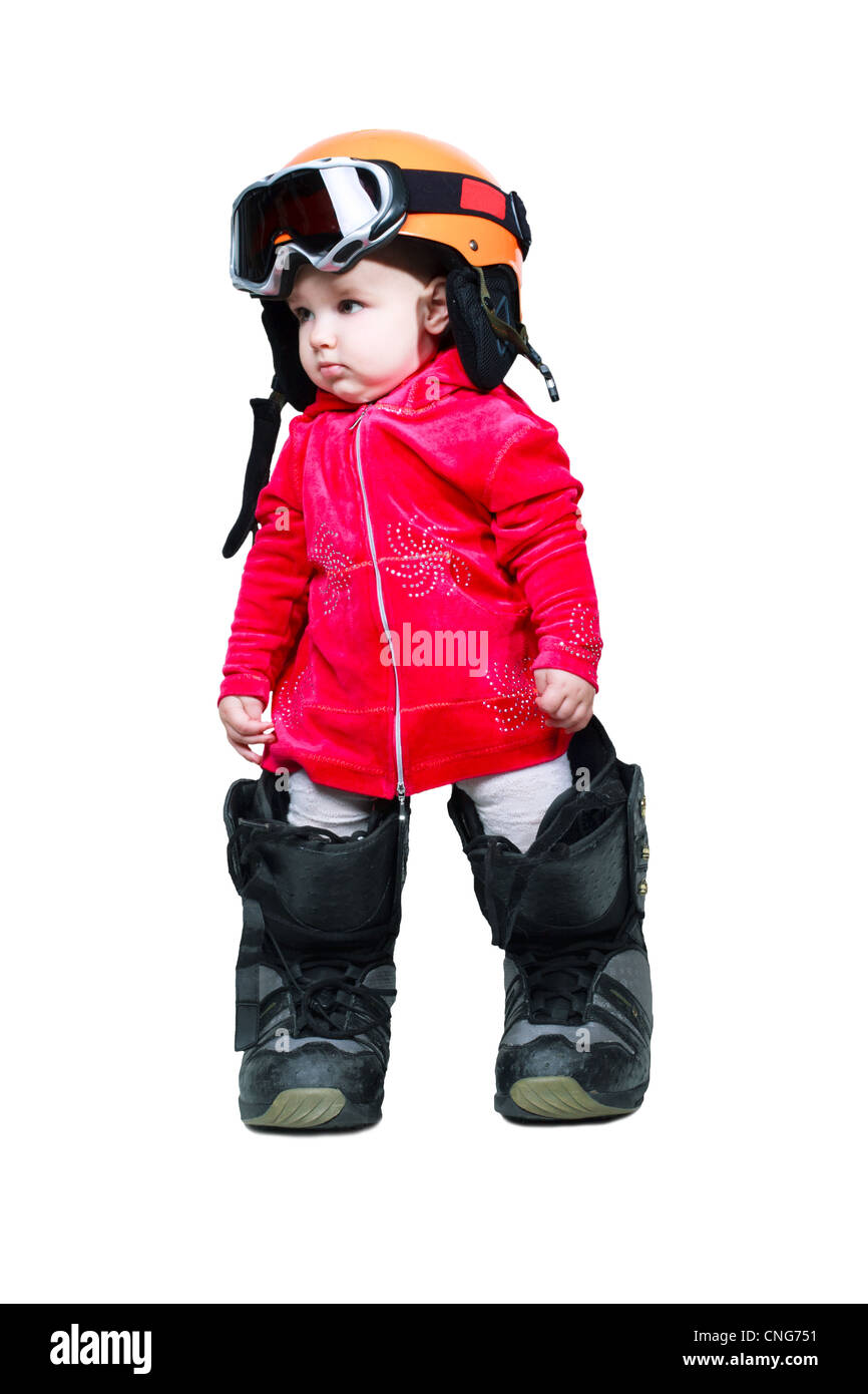 Baby in clothes snowboarder in a mask and boots looks toward Stock ...