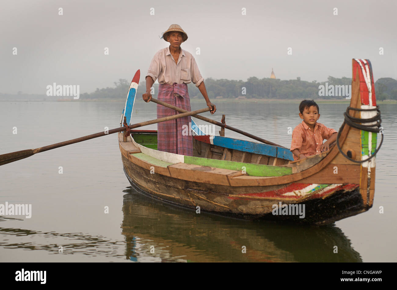 Burmese boy and father in boat, Amarapura, Taugthaman Lake, U Bein ...