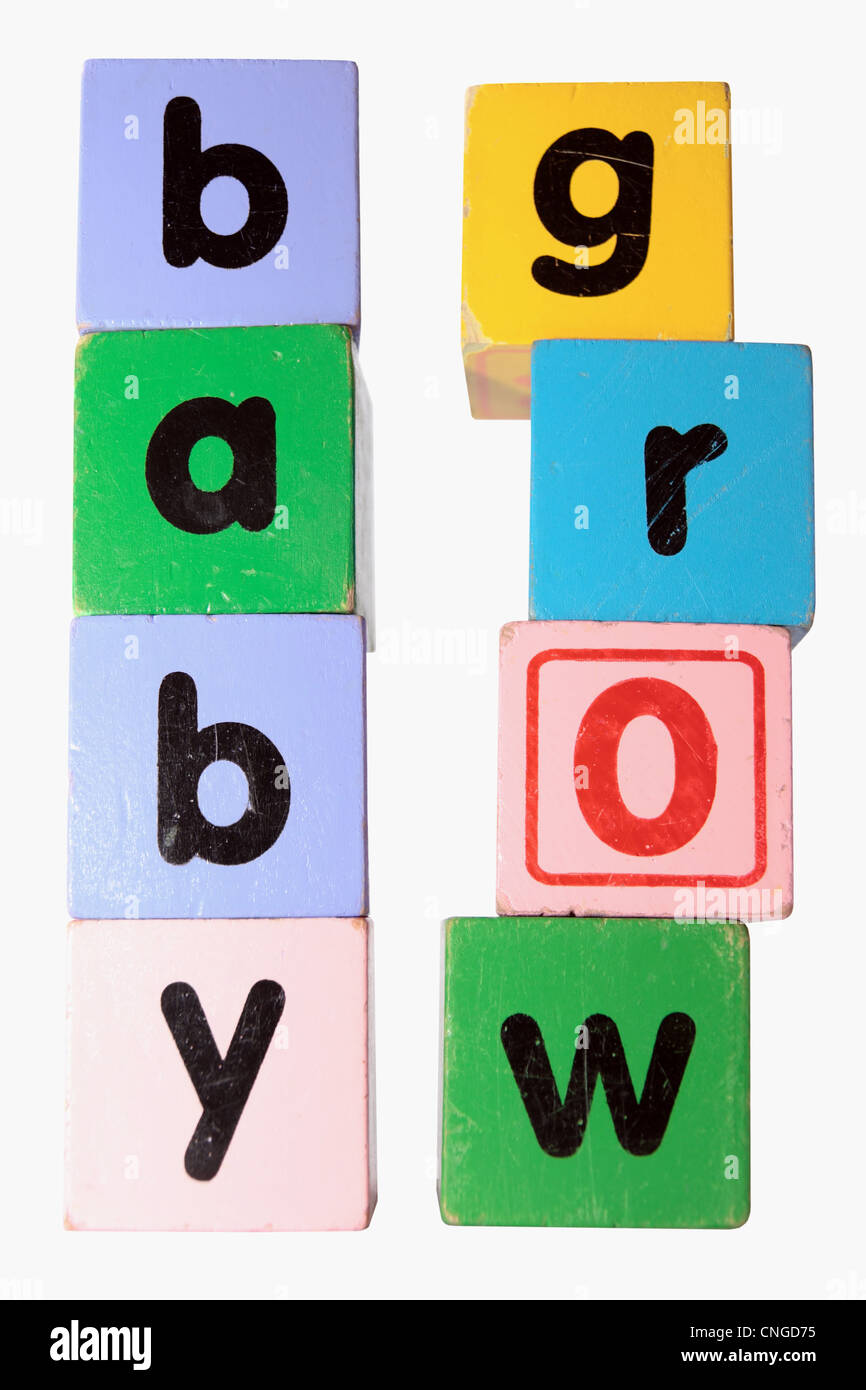 assorted childrens toy letter building blocks against a white ...