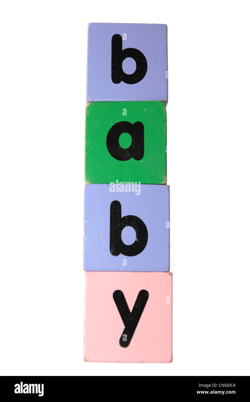 assorted childrens toy letter building blocks against a white ...