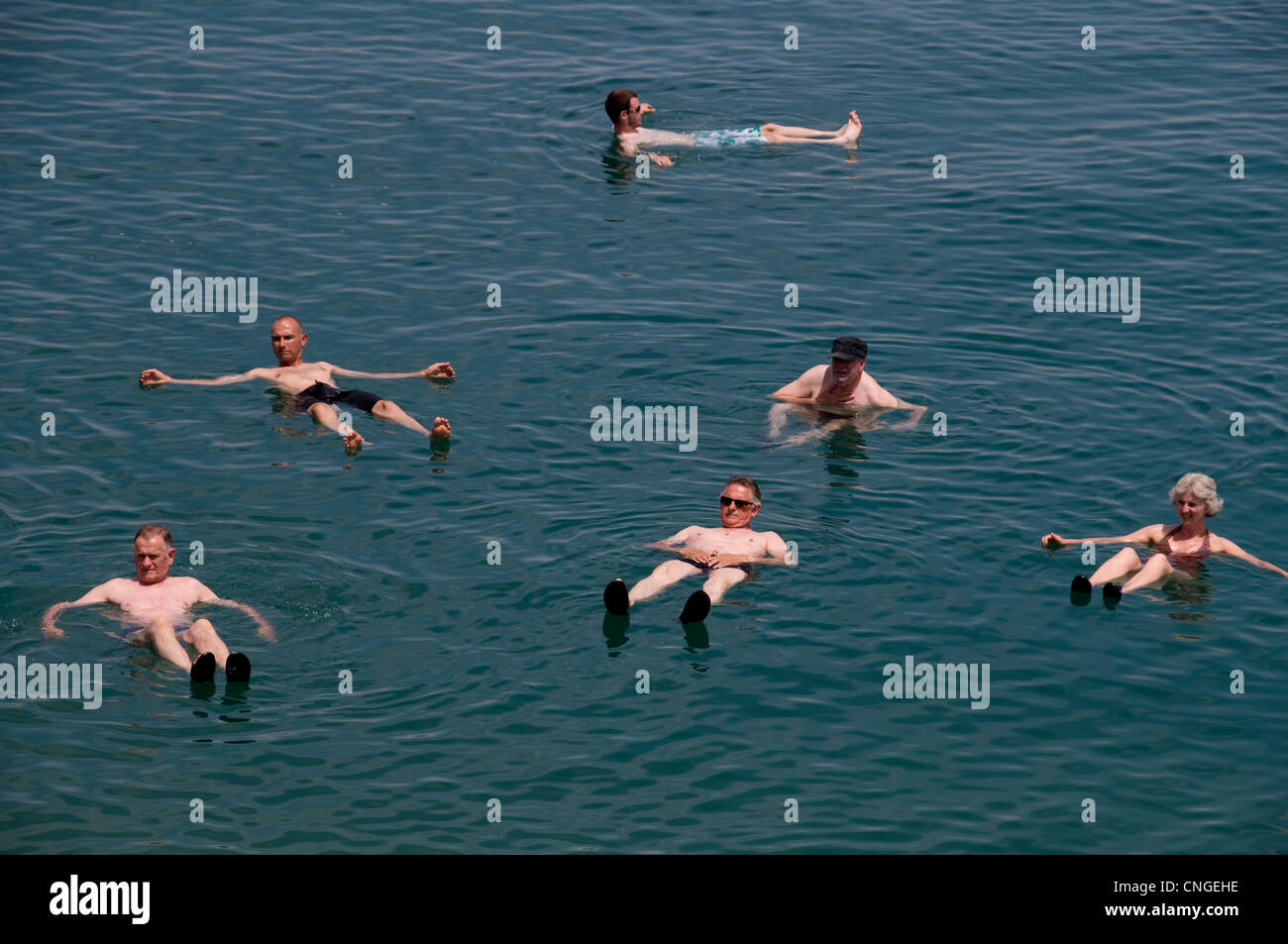 Tourists floating in Dead Sea Stock Photo - Alamy
