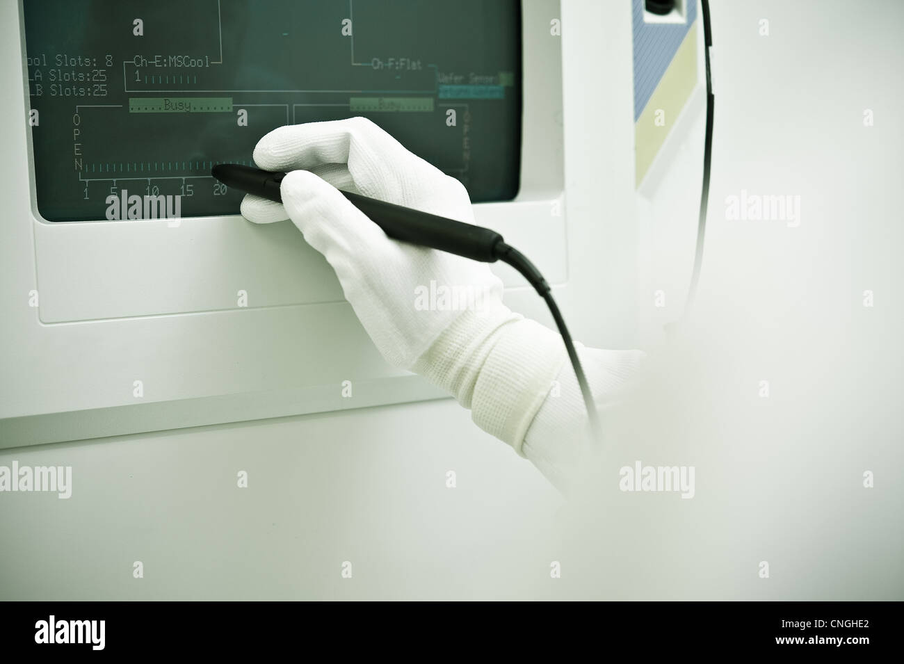 Person working in cleanroom laboratory at a touch screen monitor Stock ...
