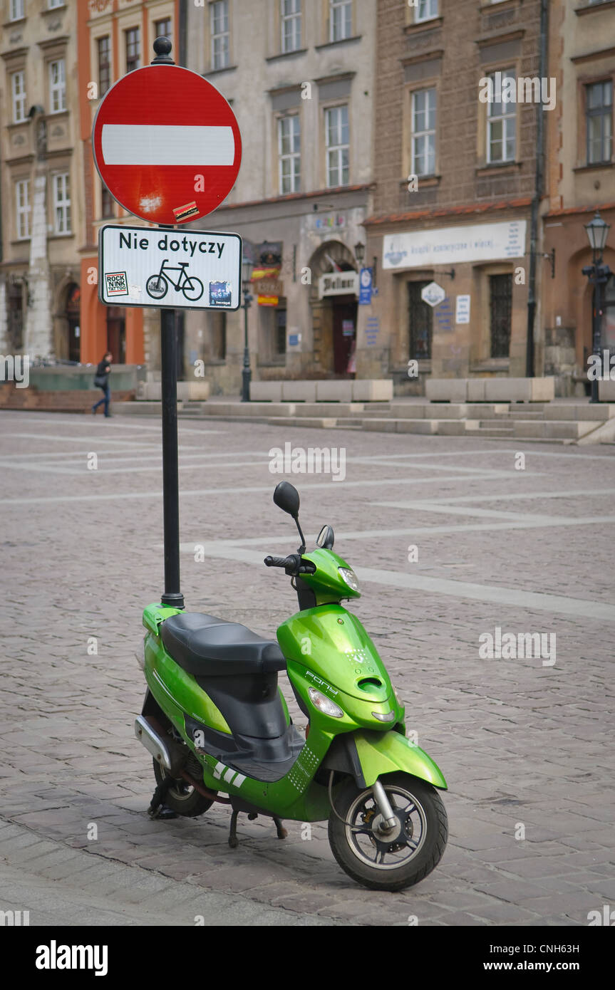 Green scooter in Little Town Square Cracow Stock Photo - Alamy