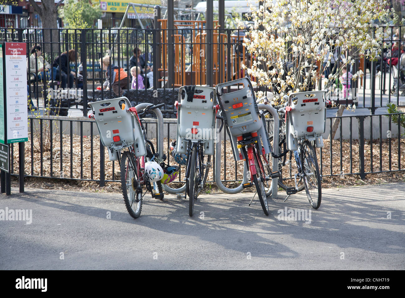 Bicycles with baby carriers parked at the Vanderbilt Playground in ...