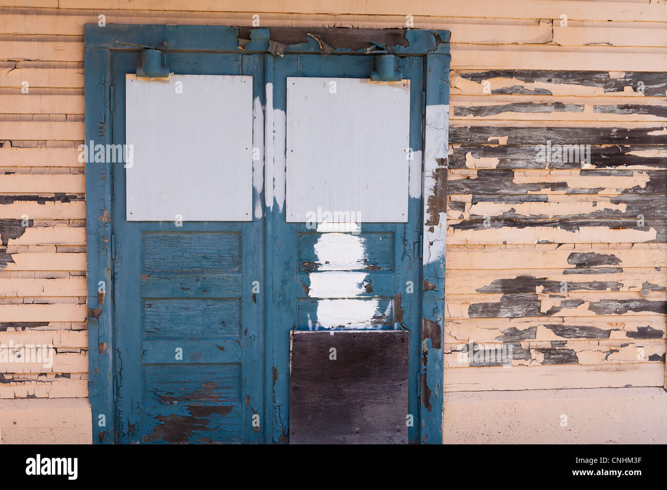 Paint peeing off of the side of an old abandoned building door Stock ...