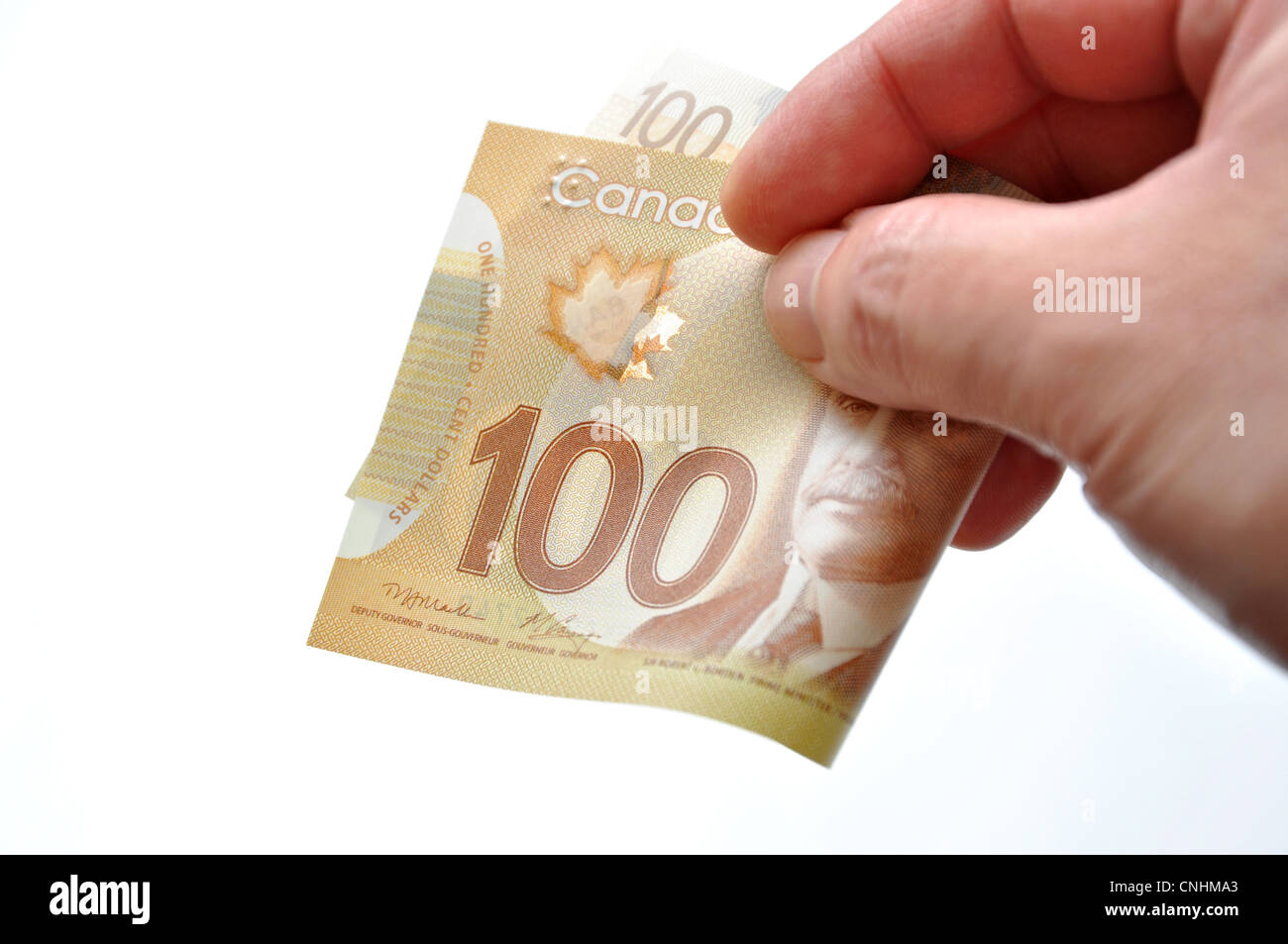Handing new one hundred bill Stock Photo - Alamy
