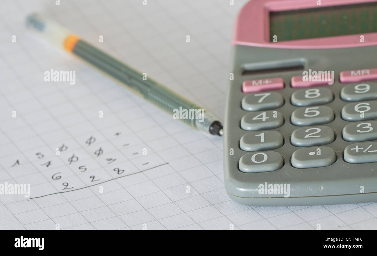 Calculator, pen and numbers on the paper for reckoning Stock Photo - Alamy