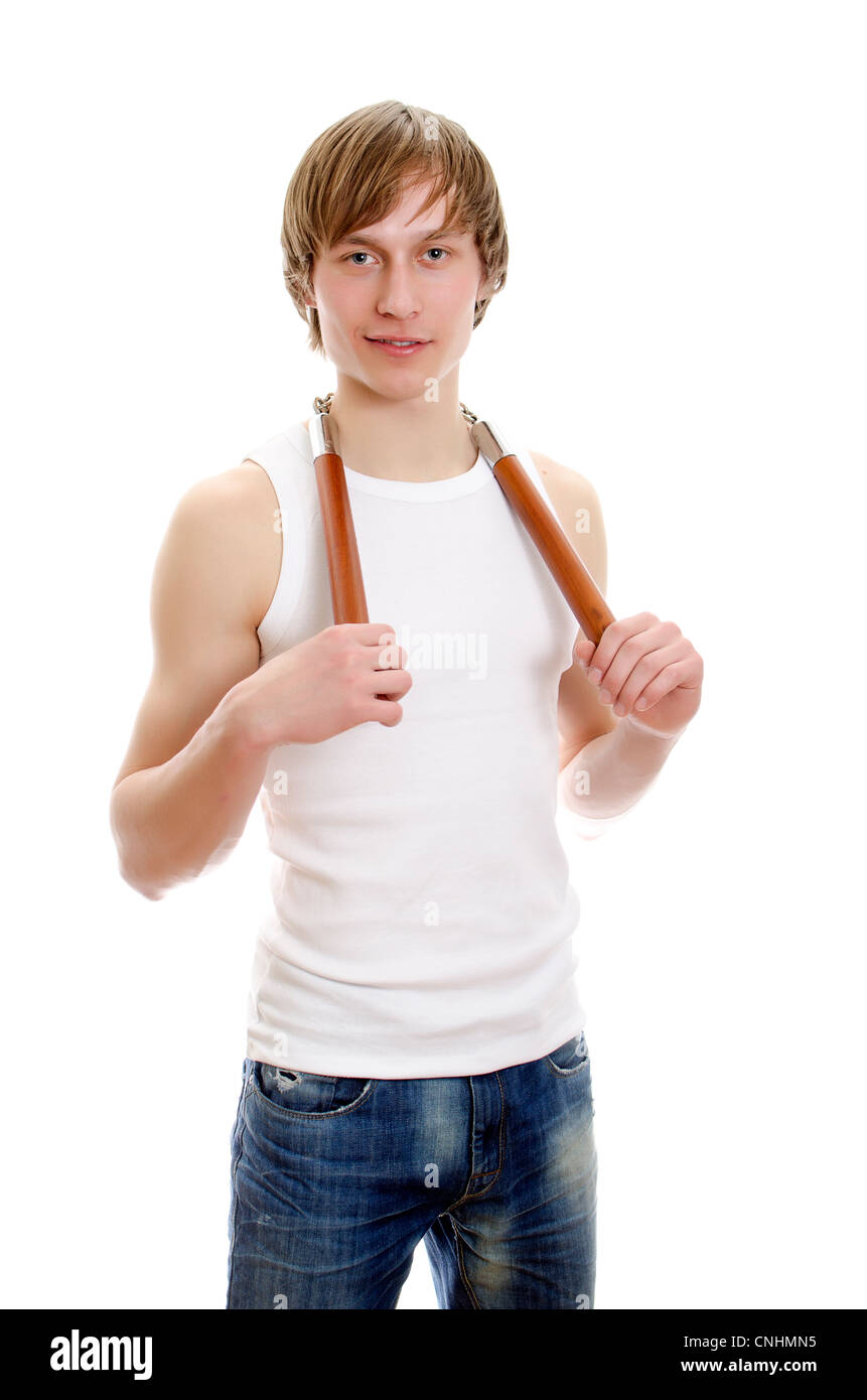 Martial Art. Man with nunchucks. Isolated over white Stock Photo - Alamy