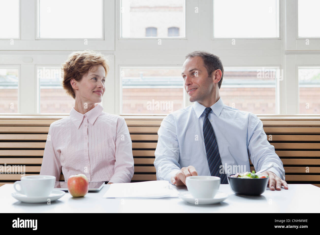 Business colleagues having lunch together Stock Photo - Alamy