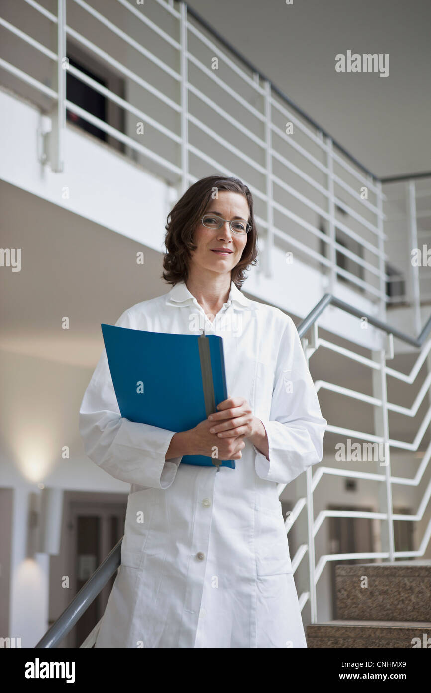 Portrait doctor holding file hi-res stock photography and images - Alamy