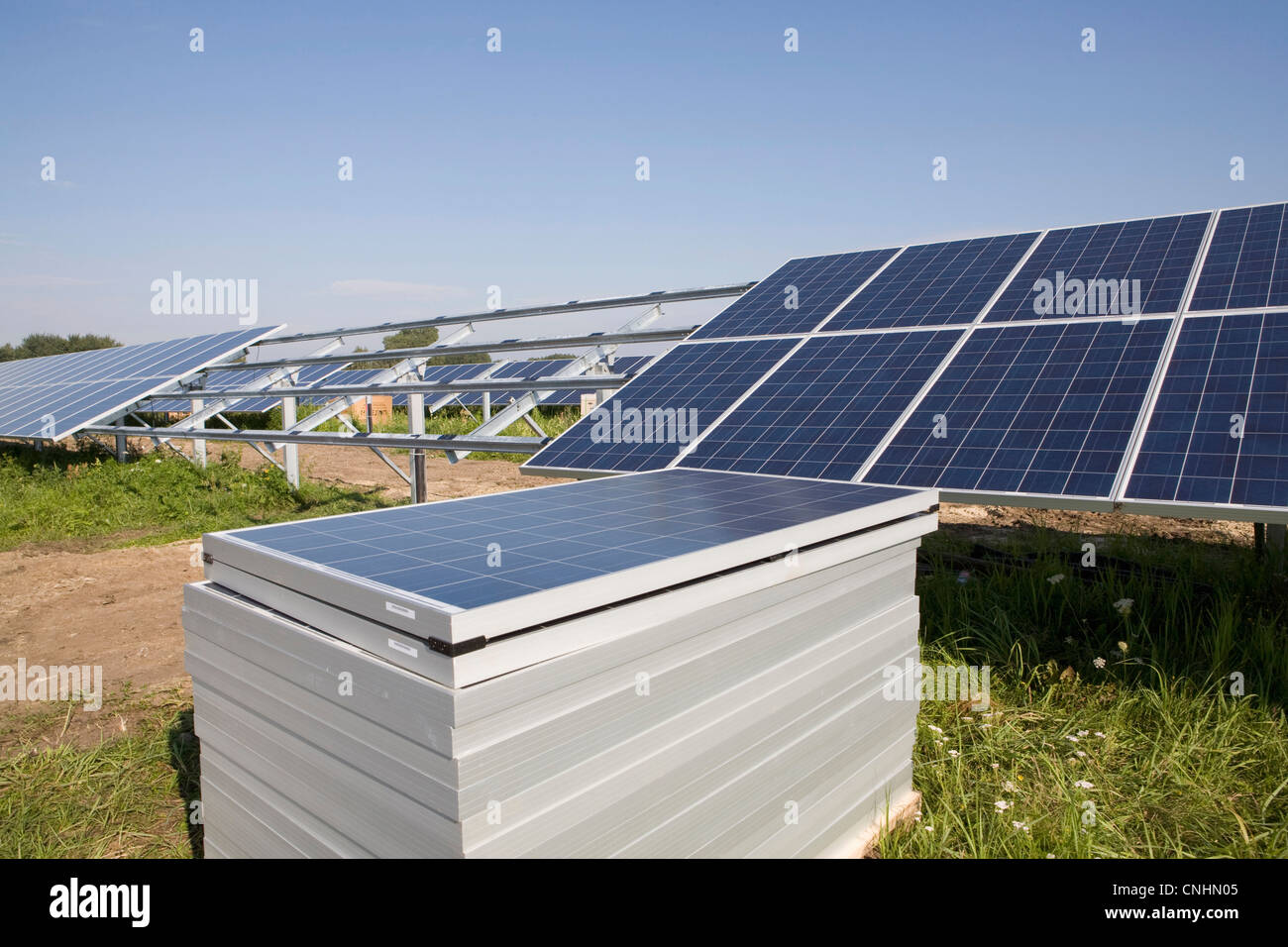 Solar panels in a field Stock Photo - Alamy