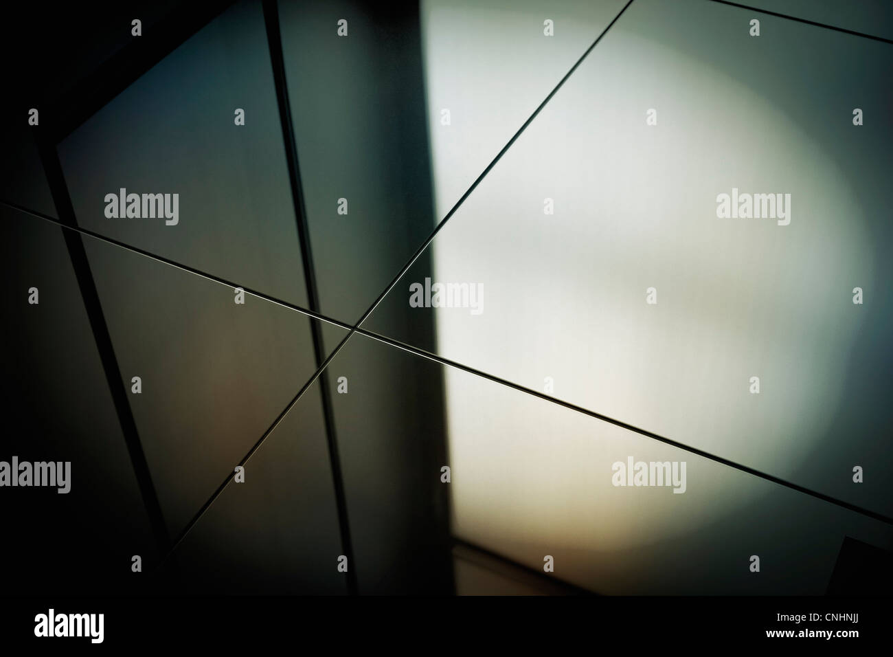 Close-up spot lit reflection in gray toned mirrors Stock Photo - Alamy