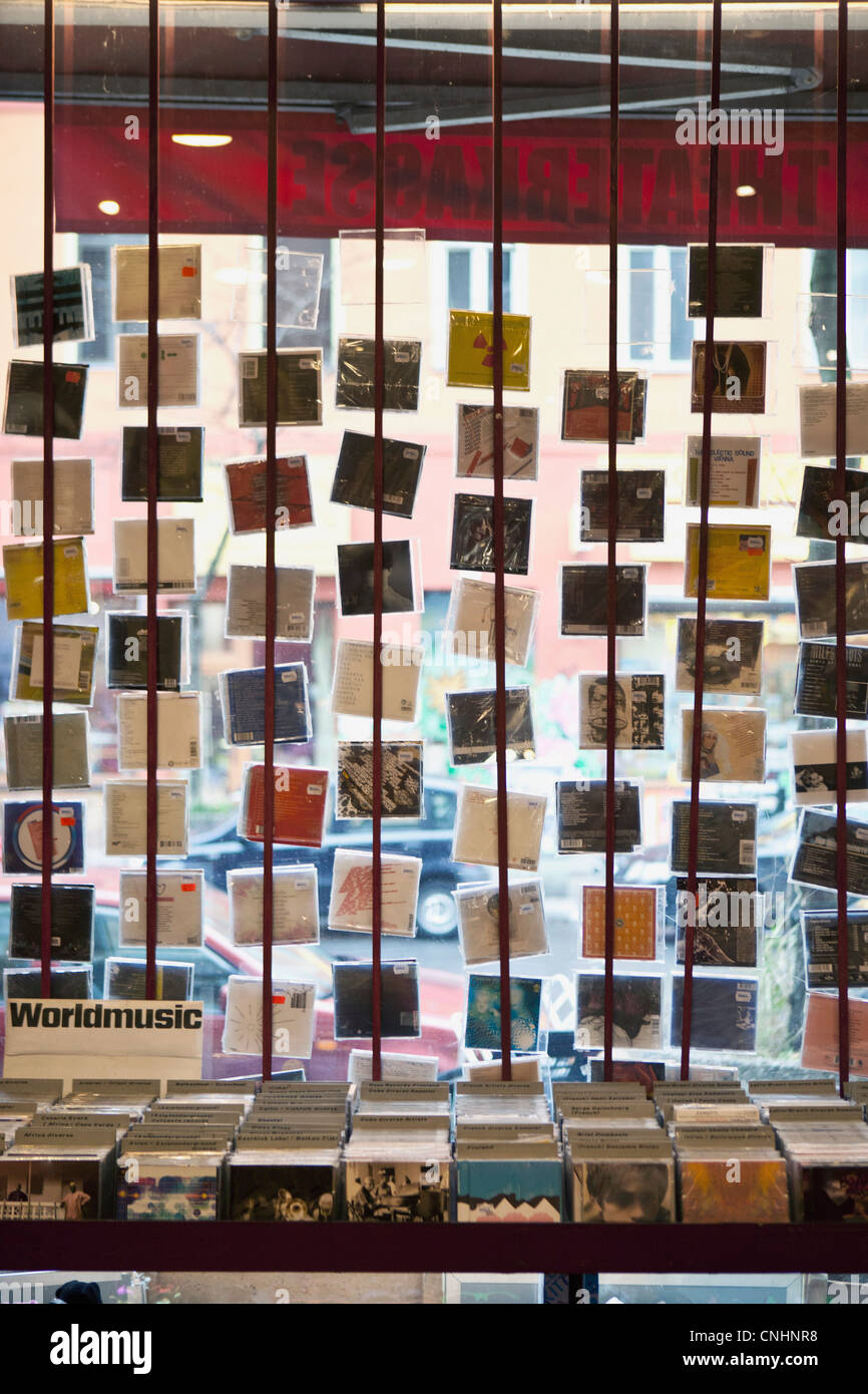 A window display of hanging compact discs in a record shop Stock Photo ...