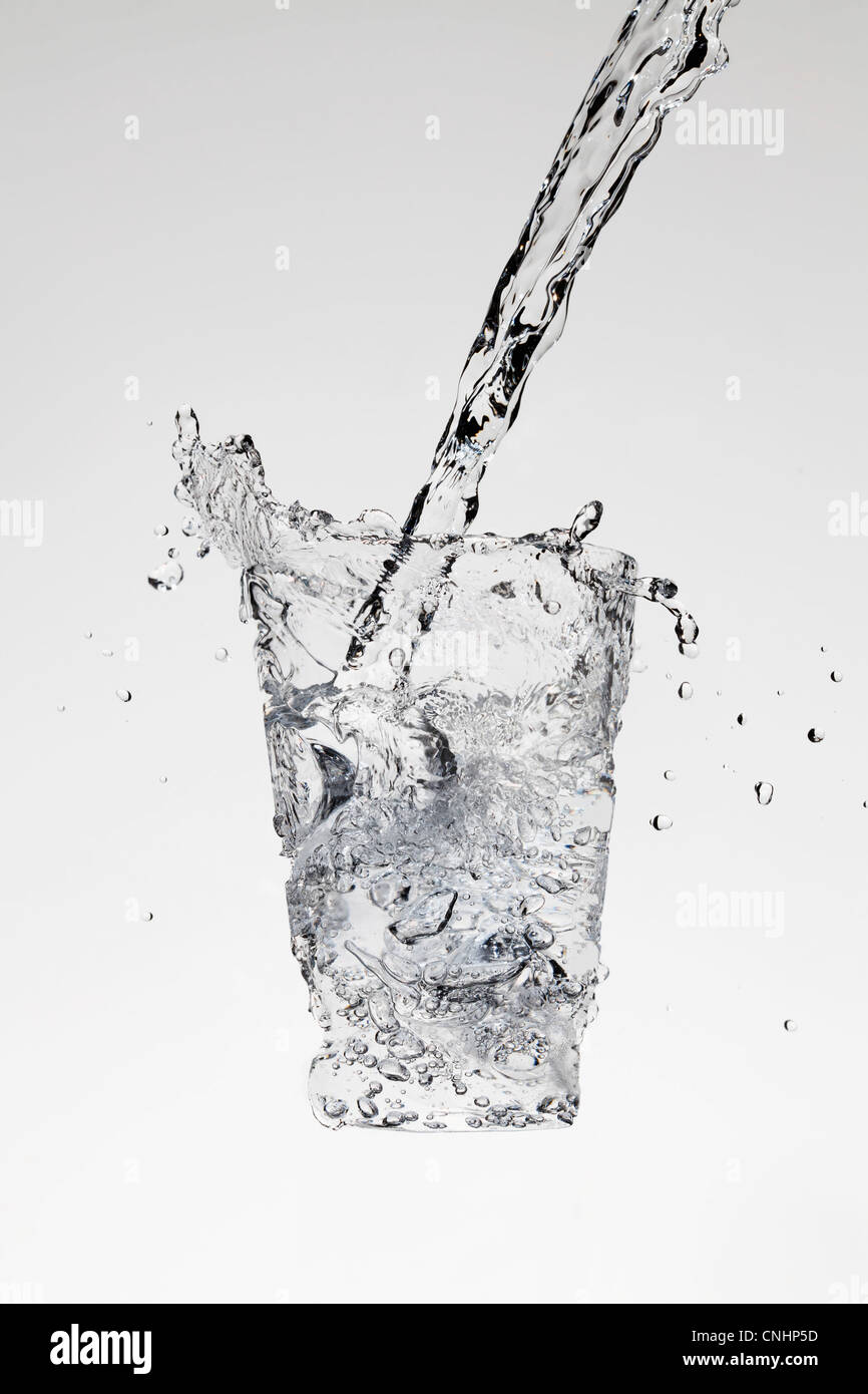 Water being poured in the form of a glass Stock Photo - Alamy