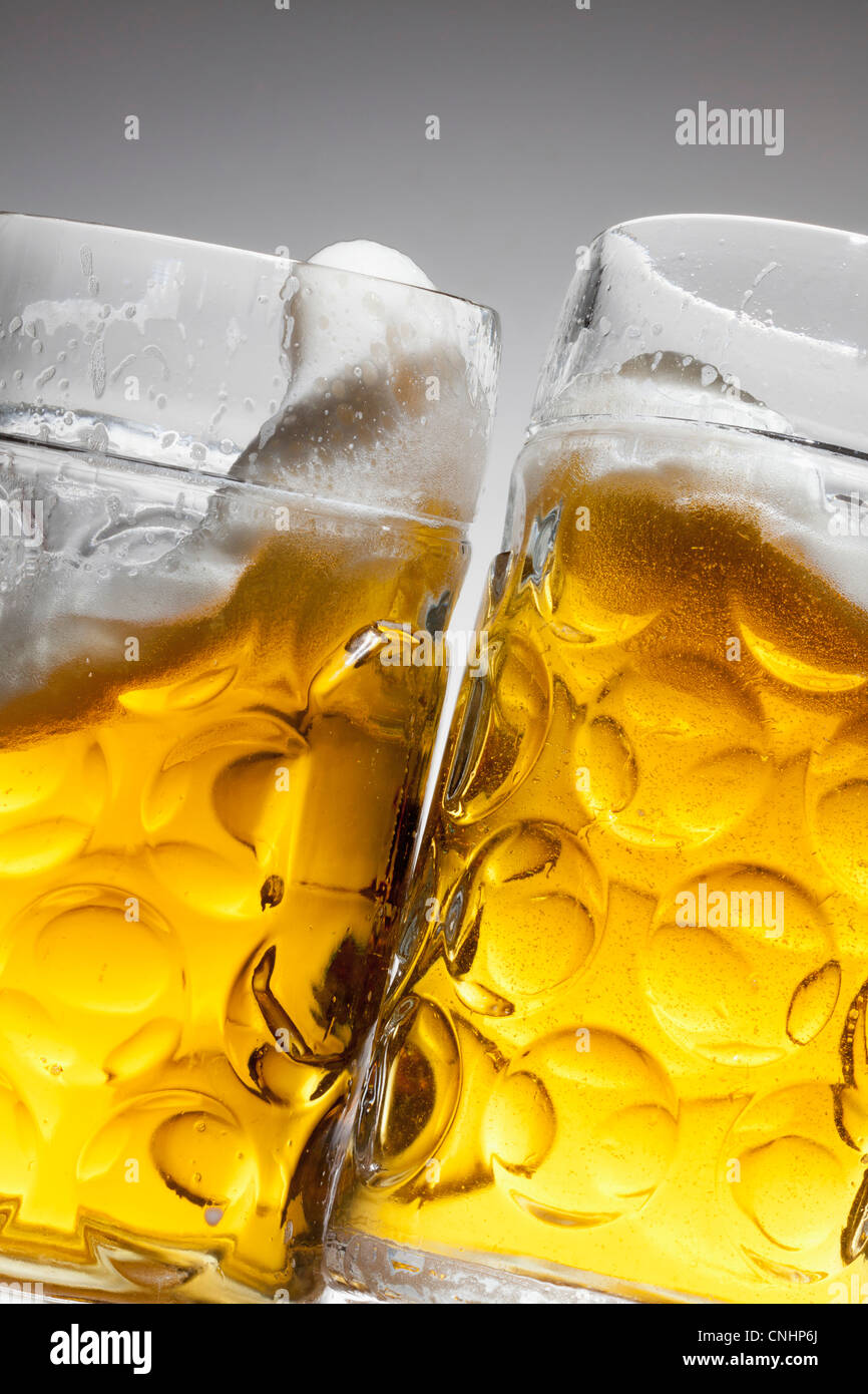 Toasting with two glasses of beer Stock Photo - Alamy