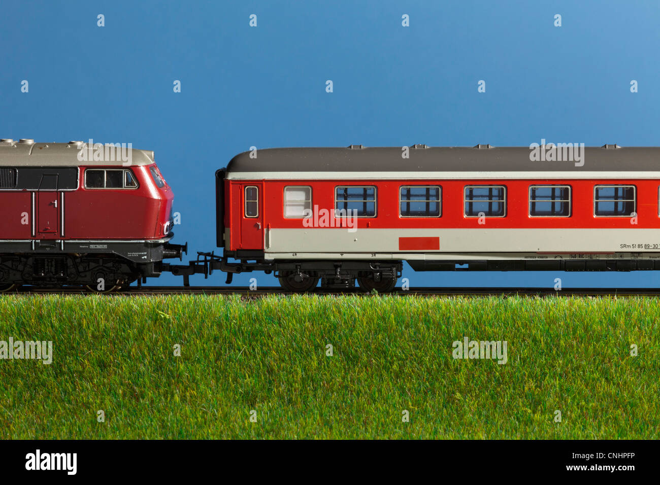 A miniature toy passenger train Stock Photo - Alamy