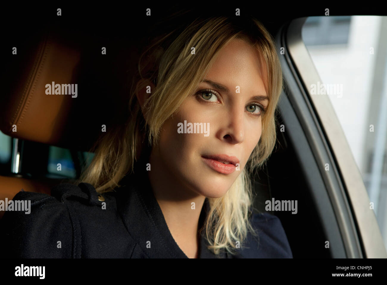 Portrait of woman in car Stock Photo - Alamy