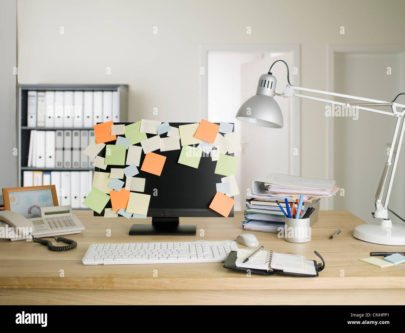 A desktop PC with blank adhesive notes all over the monitor Stock Photo ...