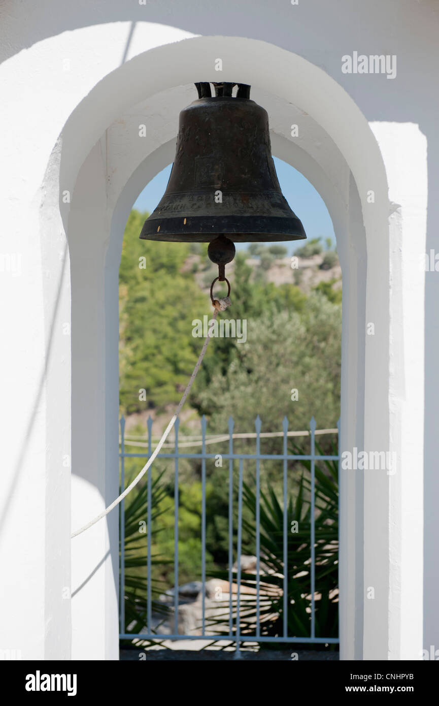 An old-fashioned bell hanging in an archway Stock Photo - Alamy