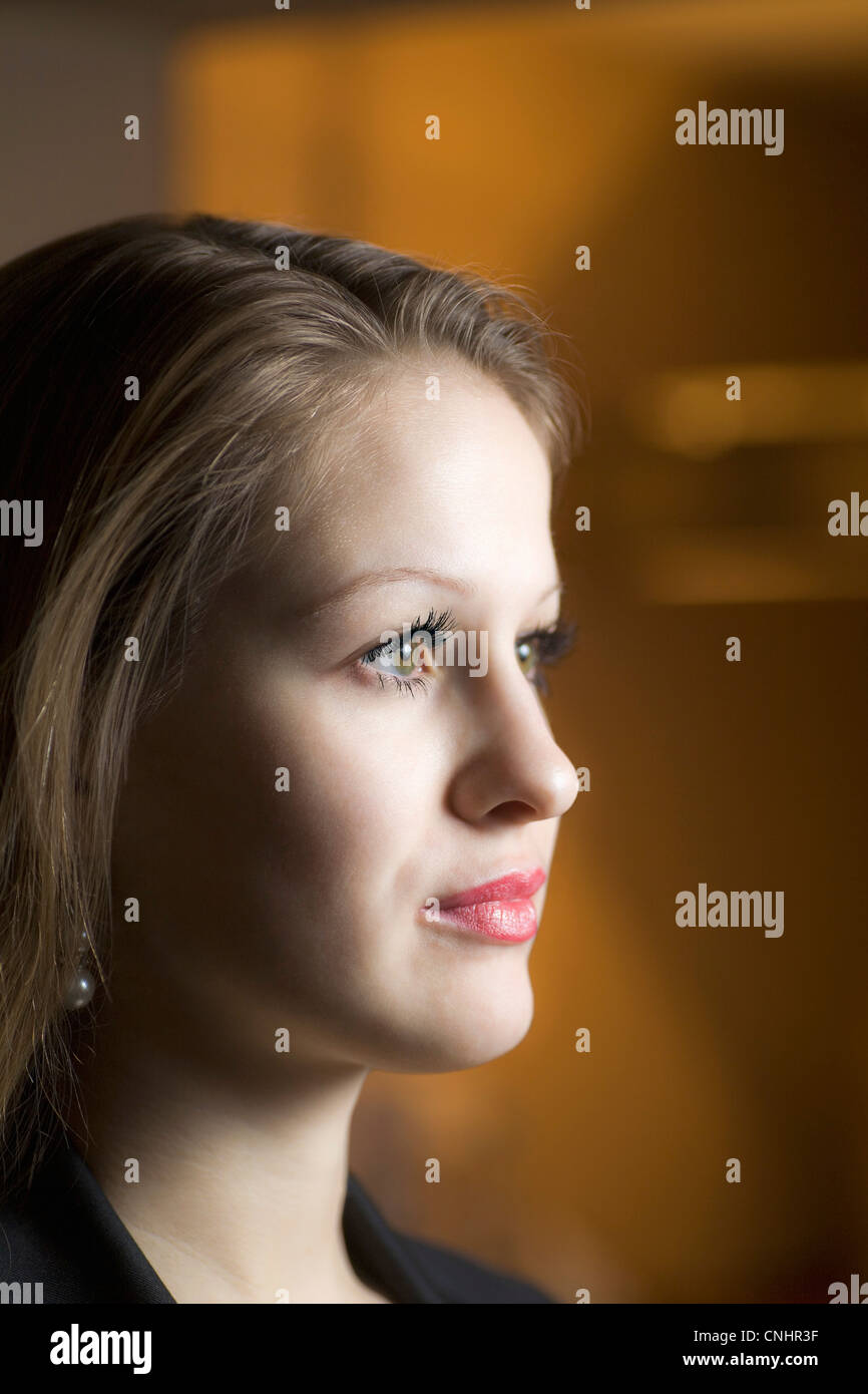 Shadowed profile of young woman Stock Photo - Alamy