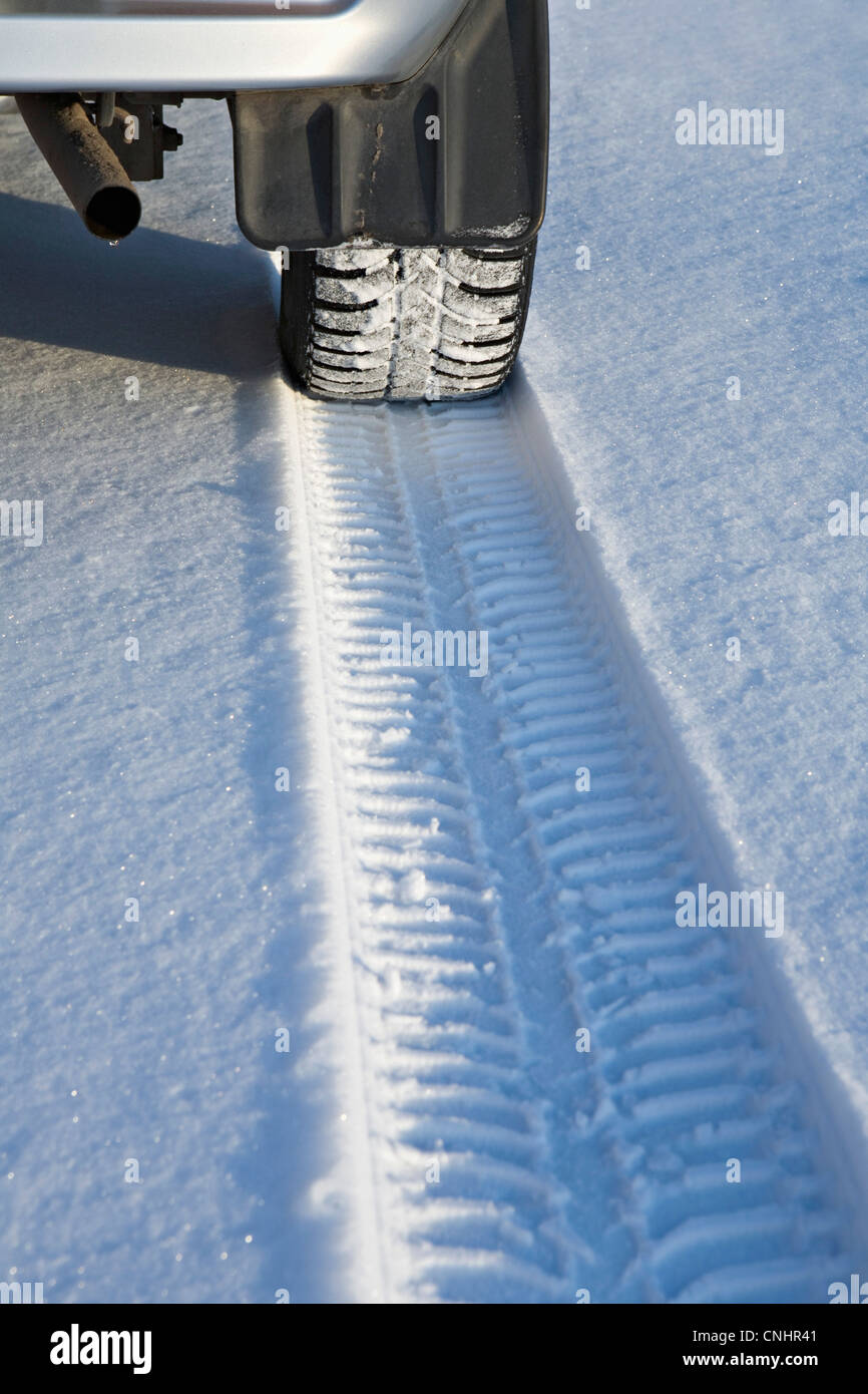 Tyre track on snow Stock Photo - Alamy
