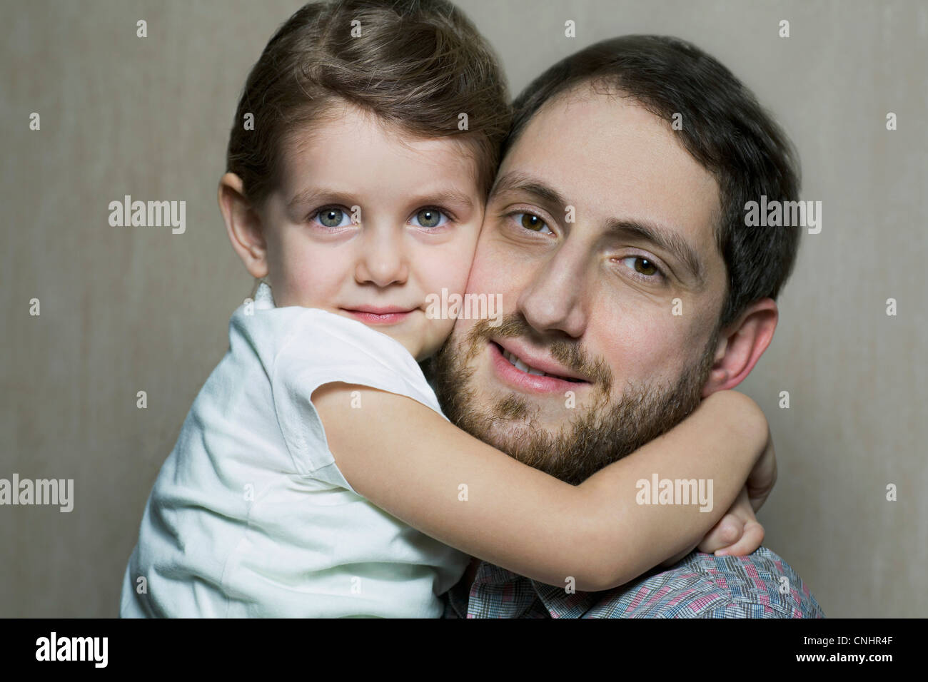 Daughter with arms around Father Stock Photo - Alamy