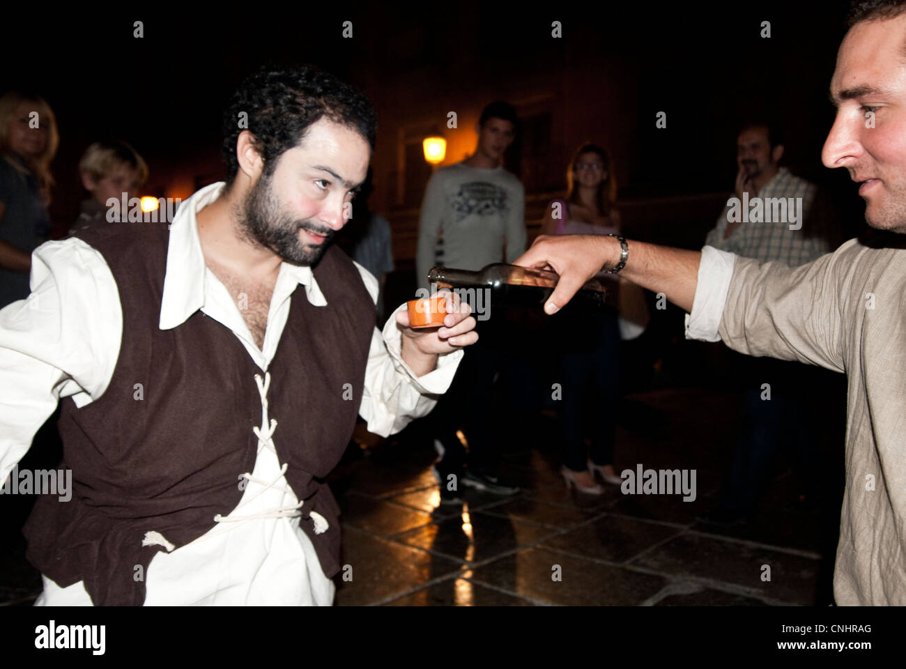 Clown drinking during traditional fiesta in Granada Stock Photo - Alamy