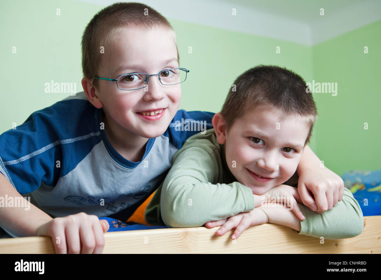 two little brothers happy together (shallow DOF; color toned image ...