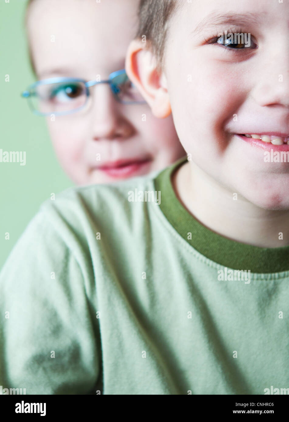 two little brothers happy together (shallow DOF; color toned image ...