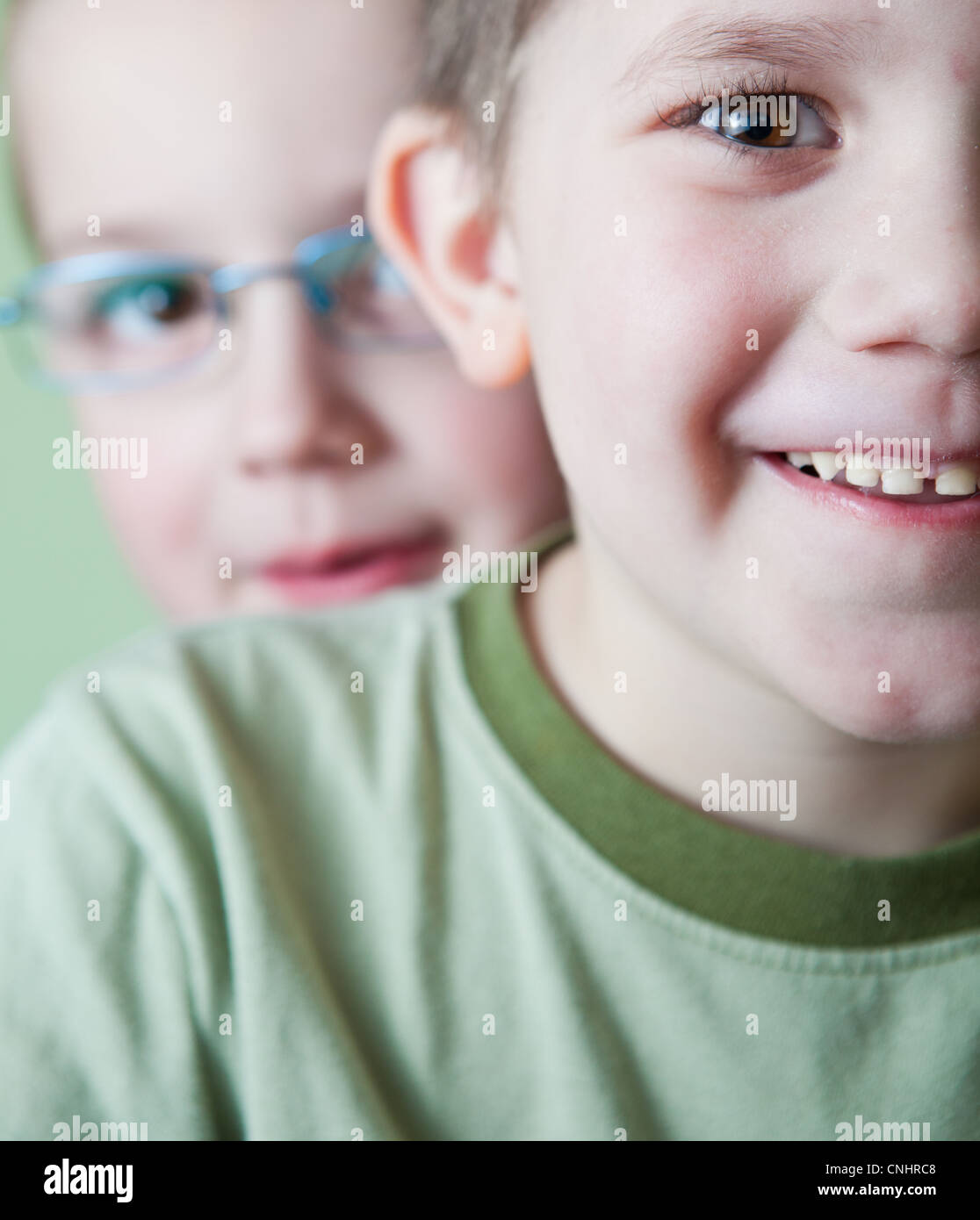 two little brothers happy together (shallow DOF; color toned image ...