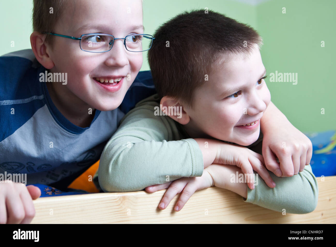 two little brothers happy together (shallow DOF; color toned image ...
