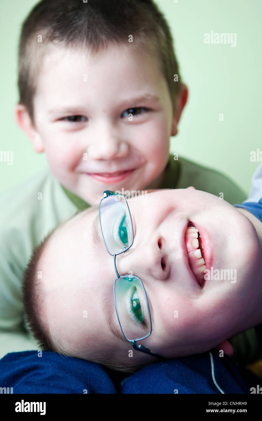 two little brothers happy together (shallow DOF; color toned image ...